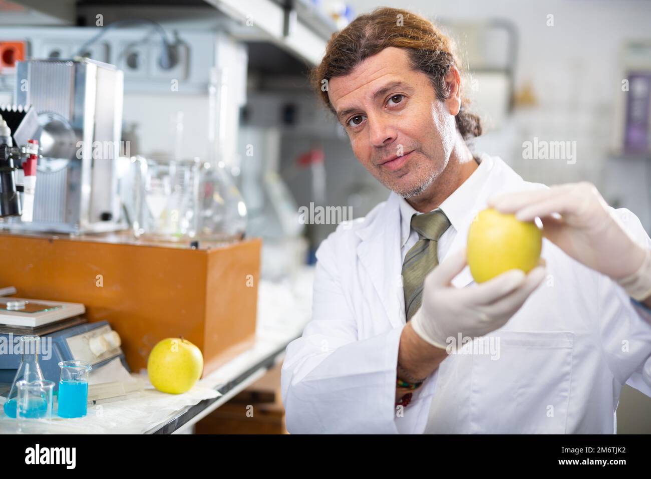 Biochemist performing GMO experiments in modern laboratory Stock Photo ...