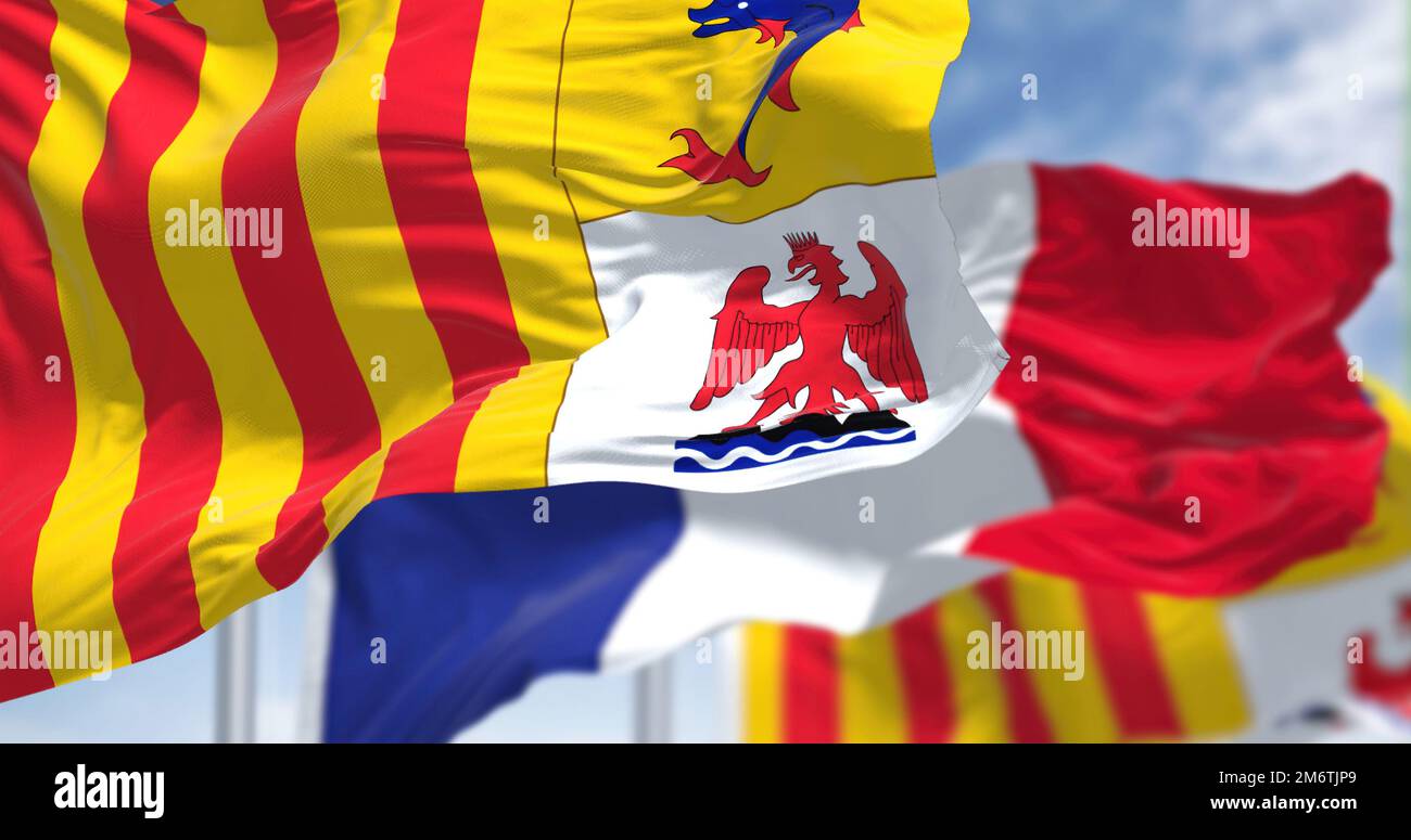 The flags of Provence-Alpes-CÃ´te d'Azur flying in the wind with the French national flag Stock ...