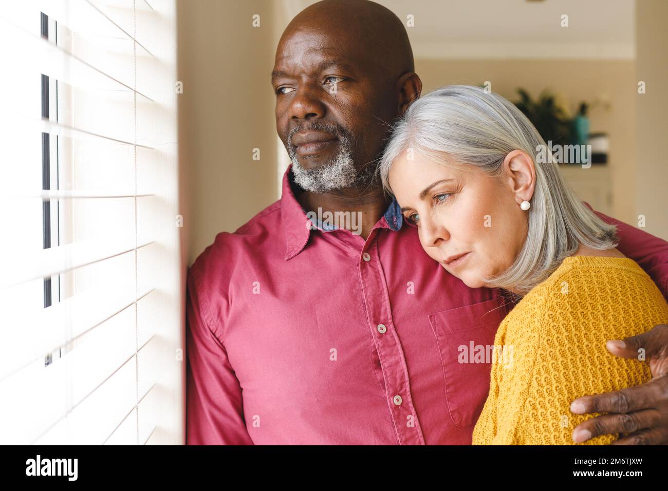 Black couple embracing sad hi-res stock photography and images - Alamy