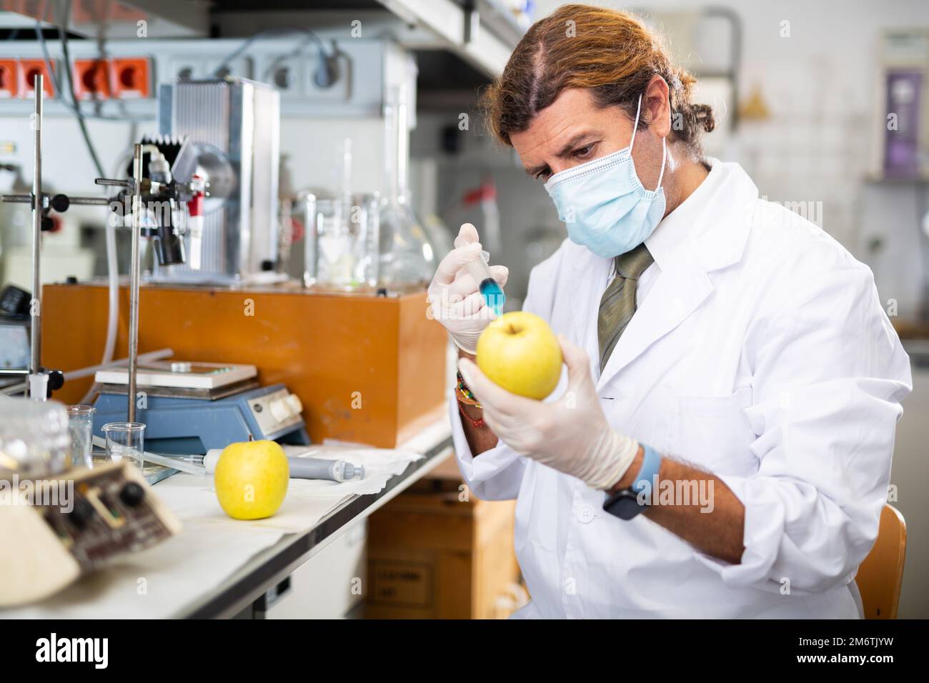 Biochemist performing GMO experiments in modern laboratory Stock Photo ...