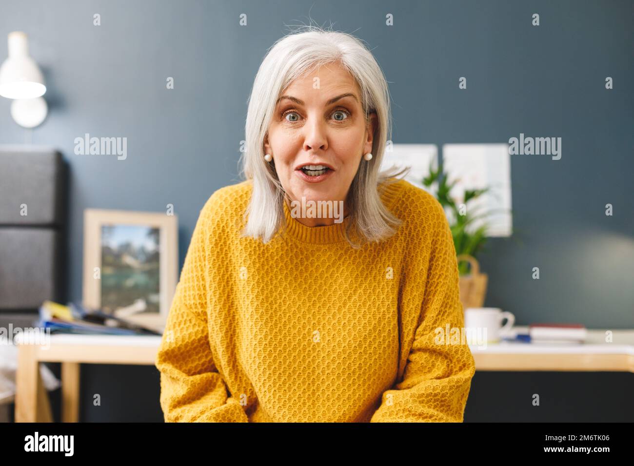Happy caucasian senior woman making video call at home making ...