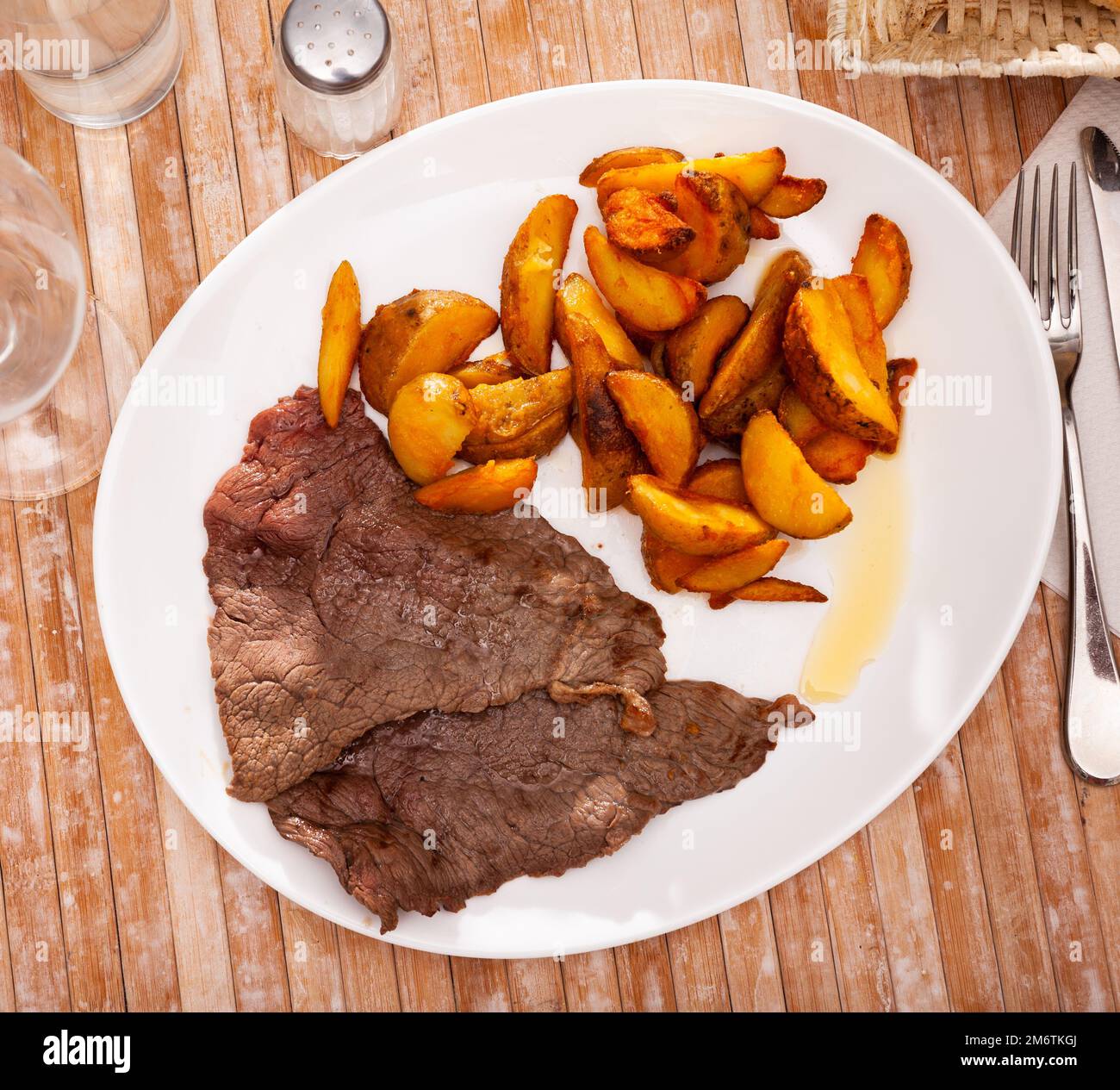 Traditional spanish grilled beef with potato Stock Photo - Alamy