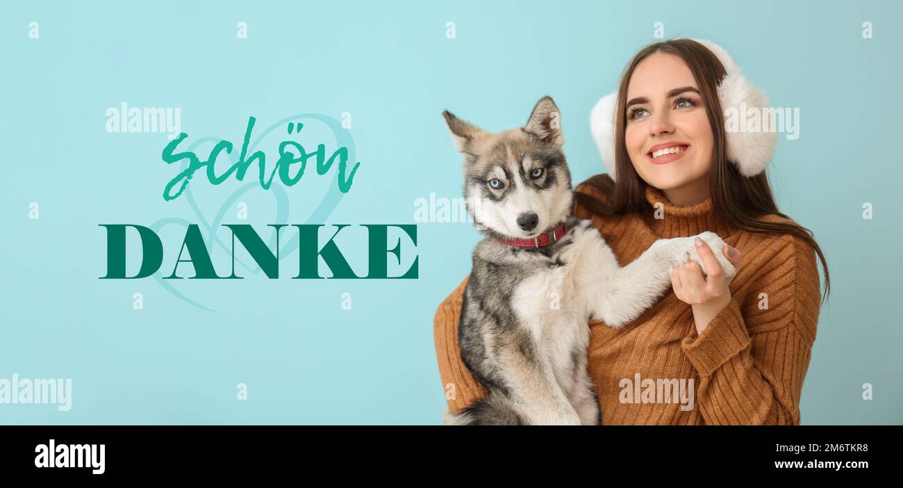 Cute woman with funny husky puppy on blue background with text DANKE ...