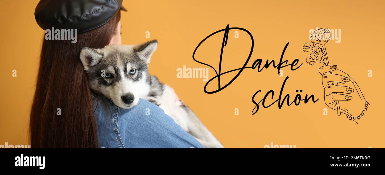 Stylish woman with funny husky puppy on ornge background with text DANKE SCHON Stock Photo - Alamy