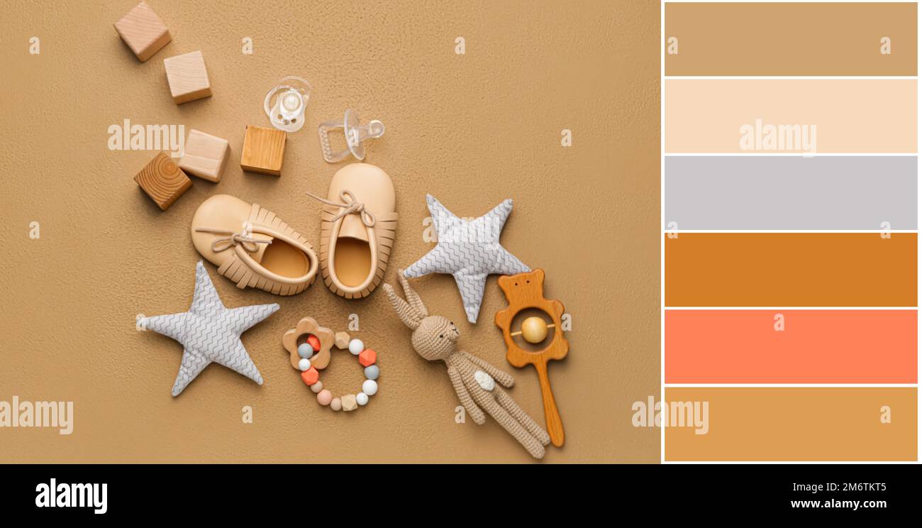 Baby booties with toys on brown background. Different color patterns ...