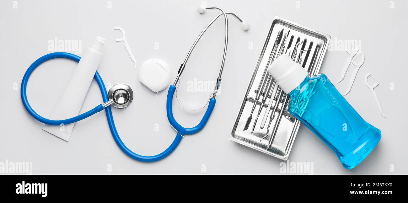 Set for oral hygiene and stethoscope on light background Stock Photo ...