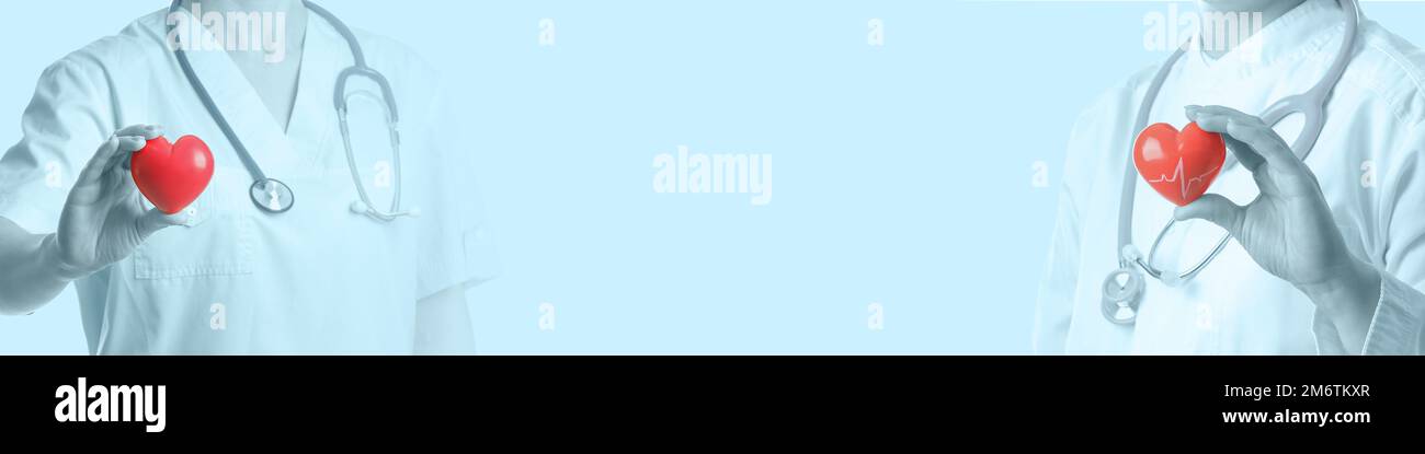 Doctors with red hearts on blue background with space for text. Banner ...