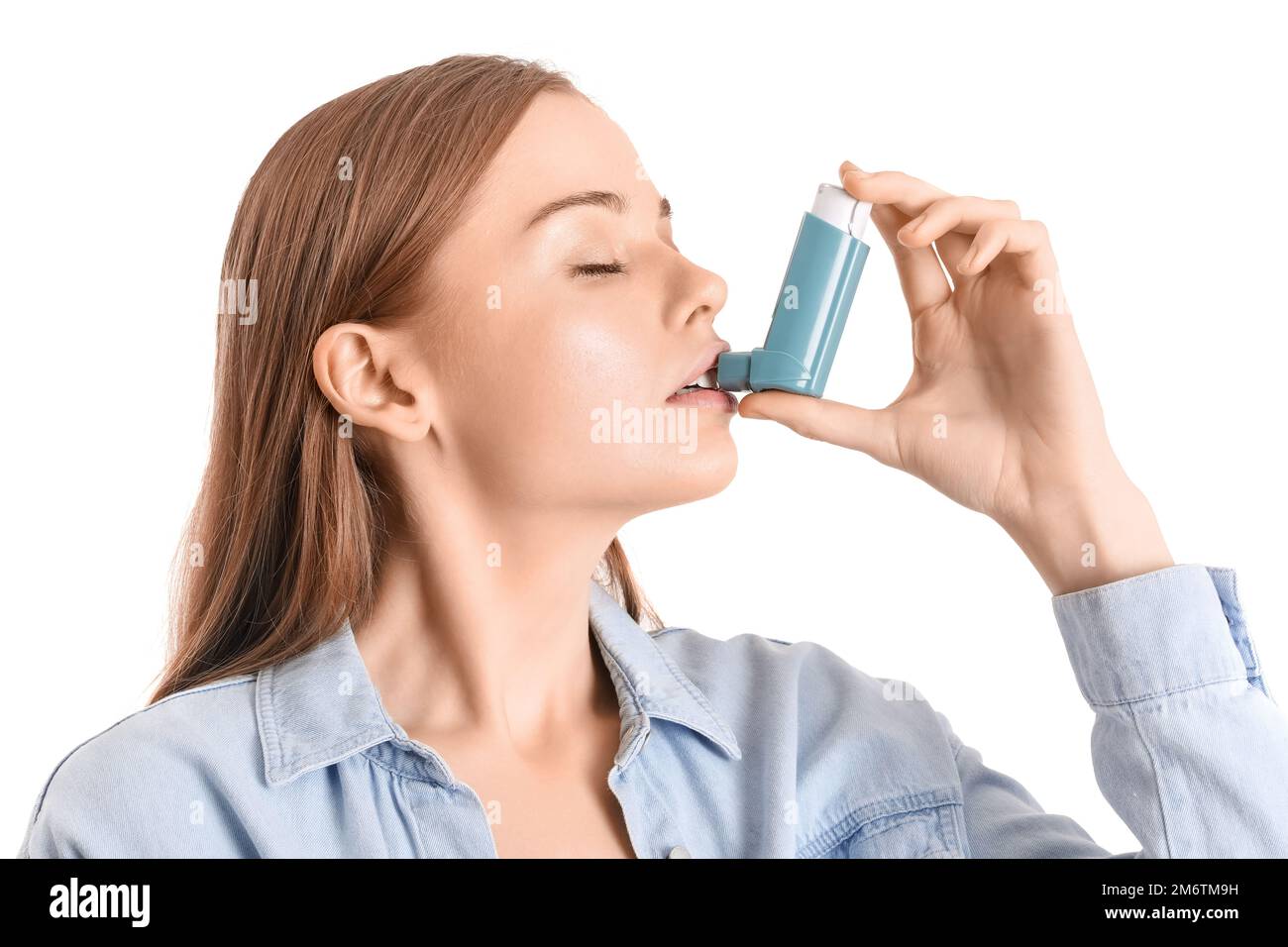 Young woman with inhaler on white background Stock Photo - Alamy