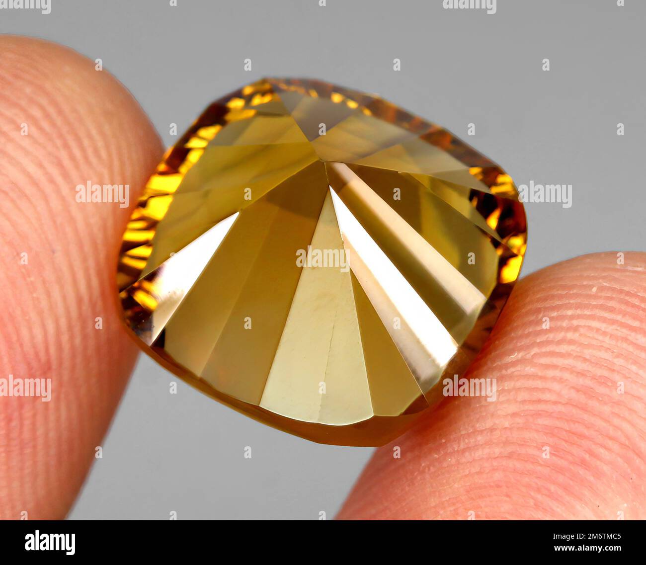 Beautiful natural citrine stone on a gray background Stock Photo - Alamy