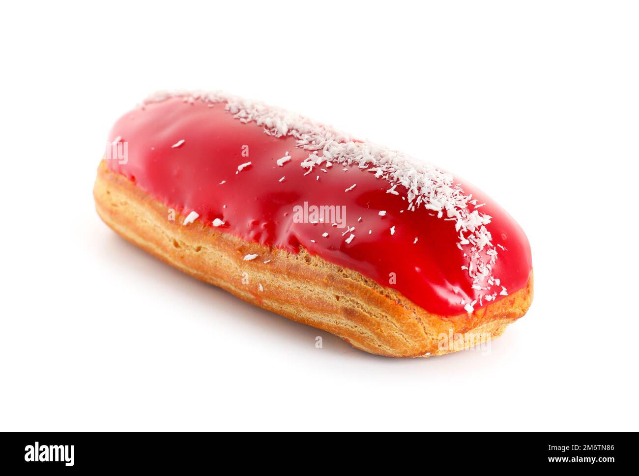 Delicious glazed eclair with coconut shavings isolated on white ...