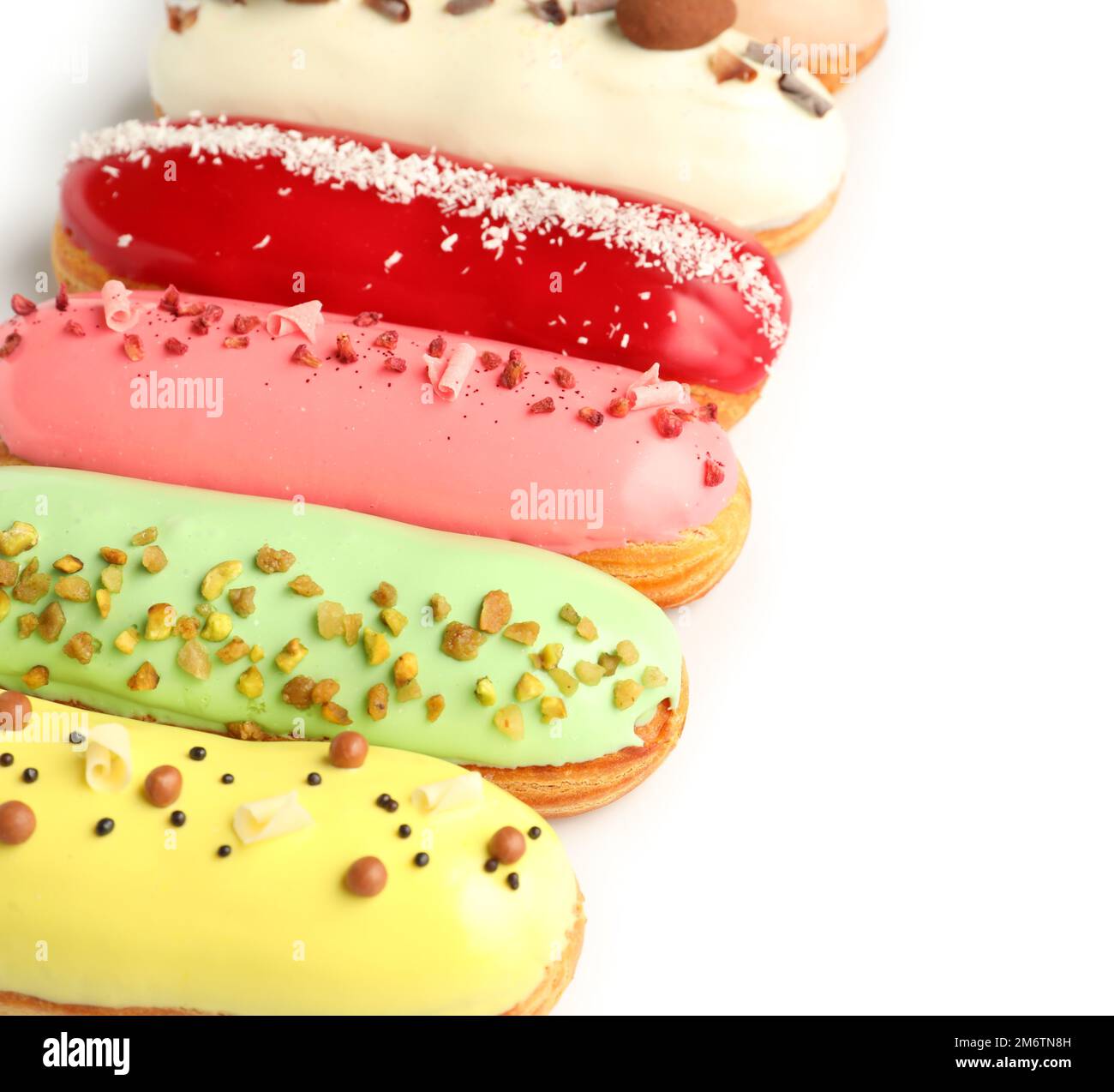 Various glazed eclairs isolated on white background Stock Photo - Alamy