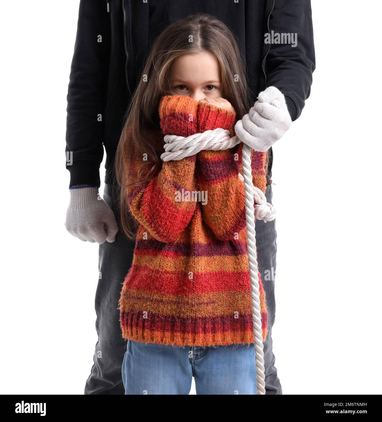 Terrorist and scared little hostage on white background Stock Photo - Alamy