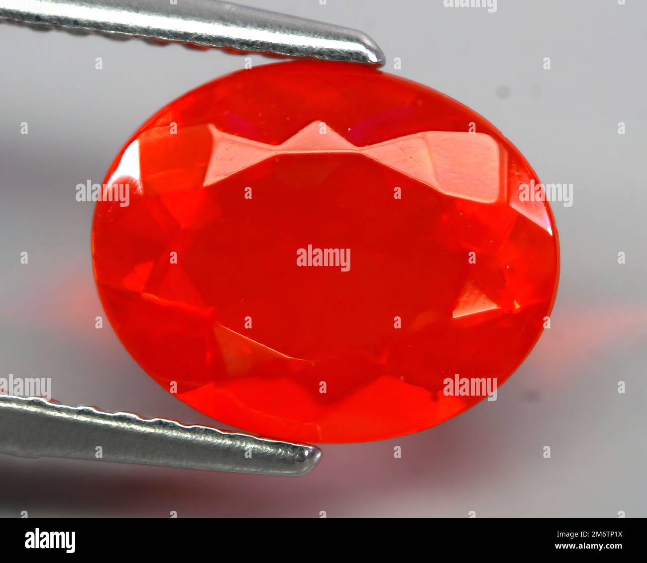 Natural beautiful stone opal on gray background Stock Photo - Alamy