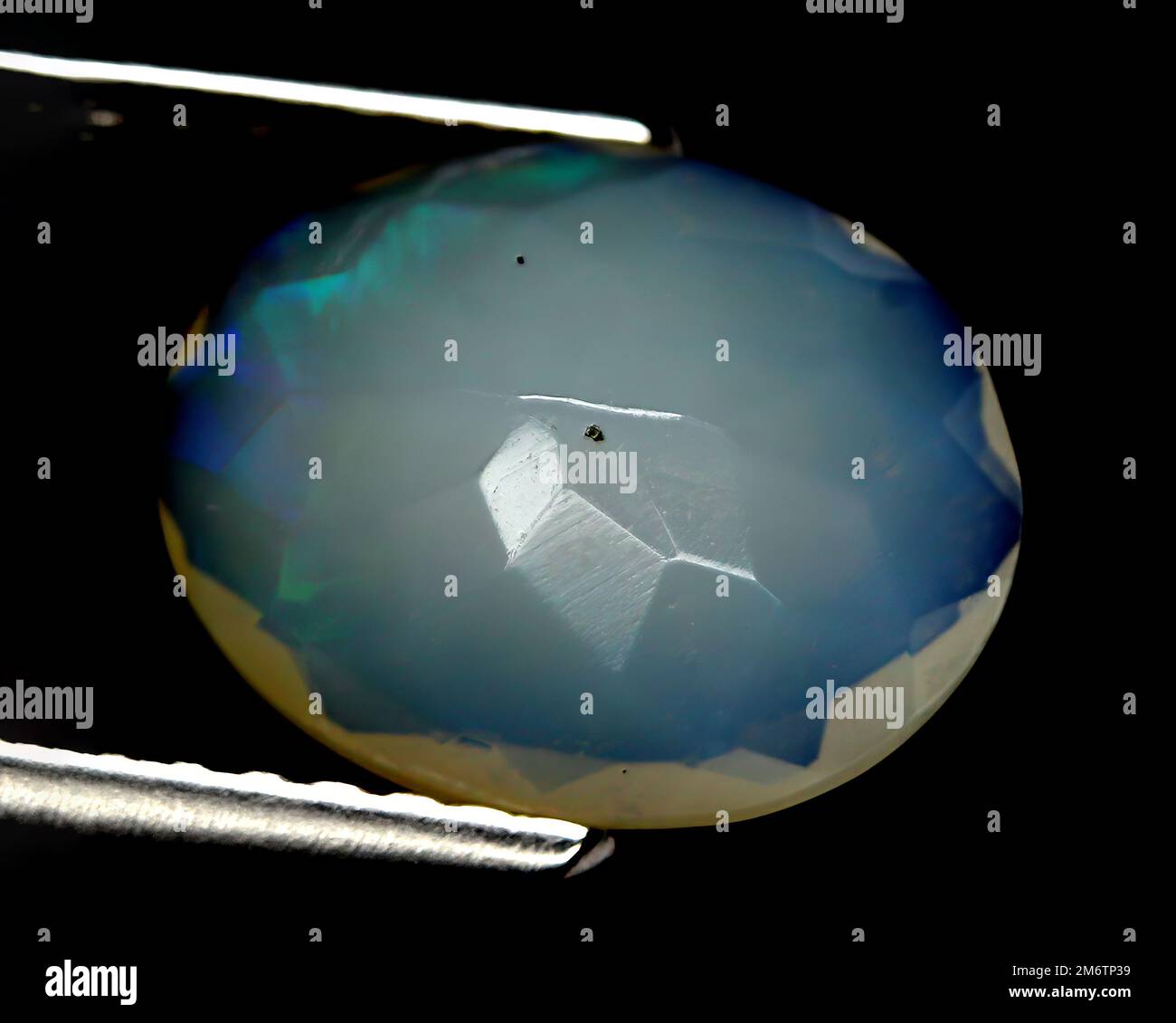 Natural beautiful stone opal on gray background Stock Photo - Alamy