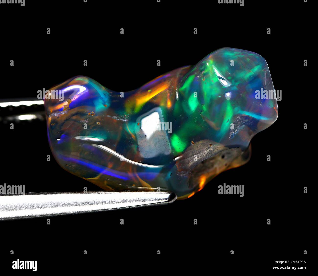 Natural beautiful stone opal on gray background Stock Photo - Alamy