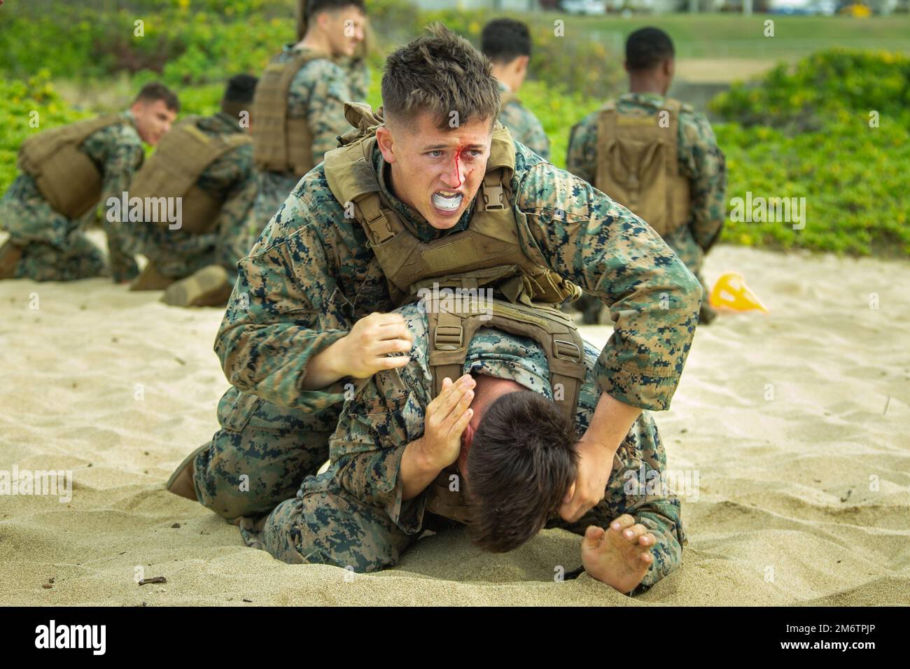 U.S. Marine Corps Cpl. Christian N. Blair, top, a machine gunner, 3rd Battalion, 3rd Marine ...