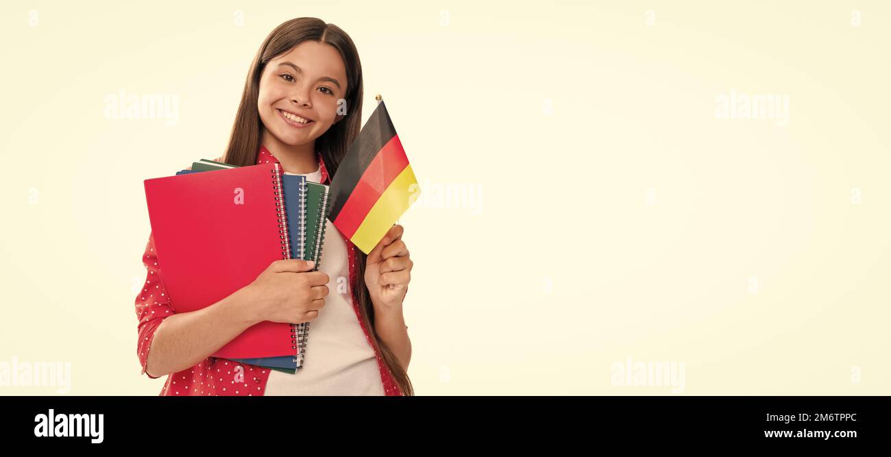 happy kid hold german flag and school copybook for studying isolated on ...
