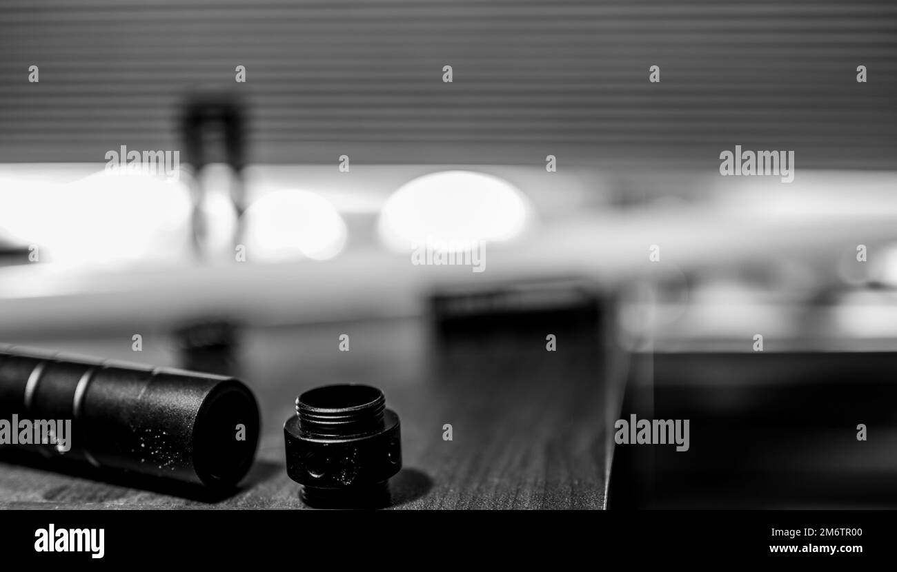 Assorted parts to build a laser sword from a kit with a hilt, neon ...