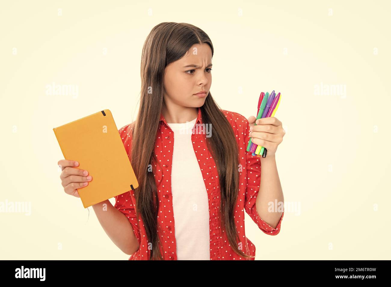 Teenage school girl with books. Schoolgirl student. Angry teenager girl ...