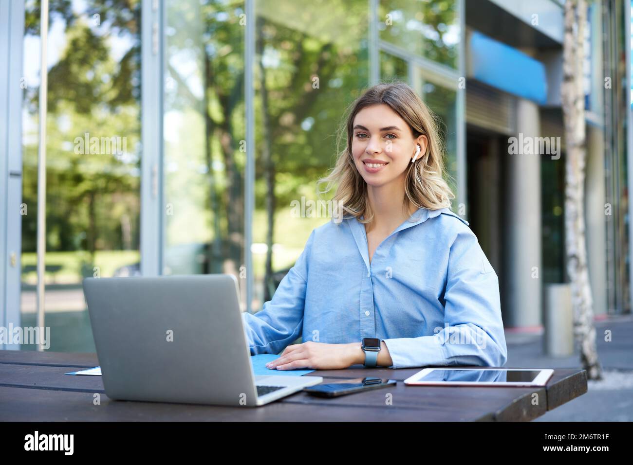 Portrait of young beautiful working woman, works on remote with laptop ...