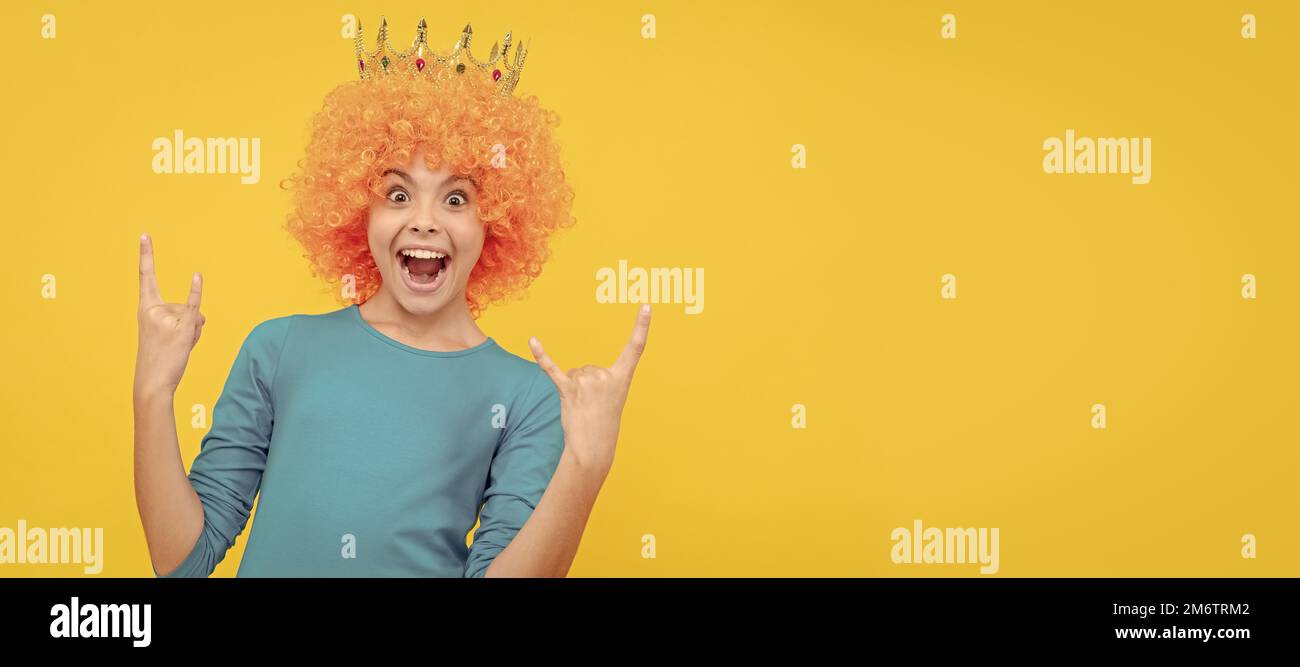 happy selfish child girl in curly wig and princess diadem, happiness ...