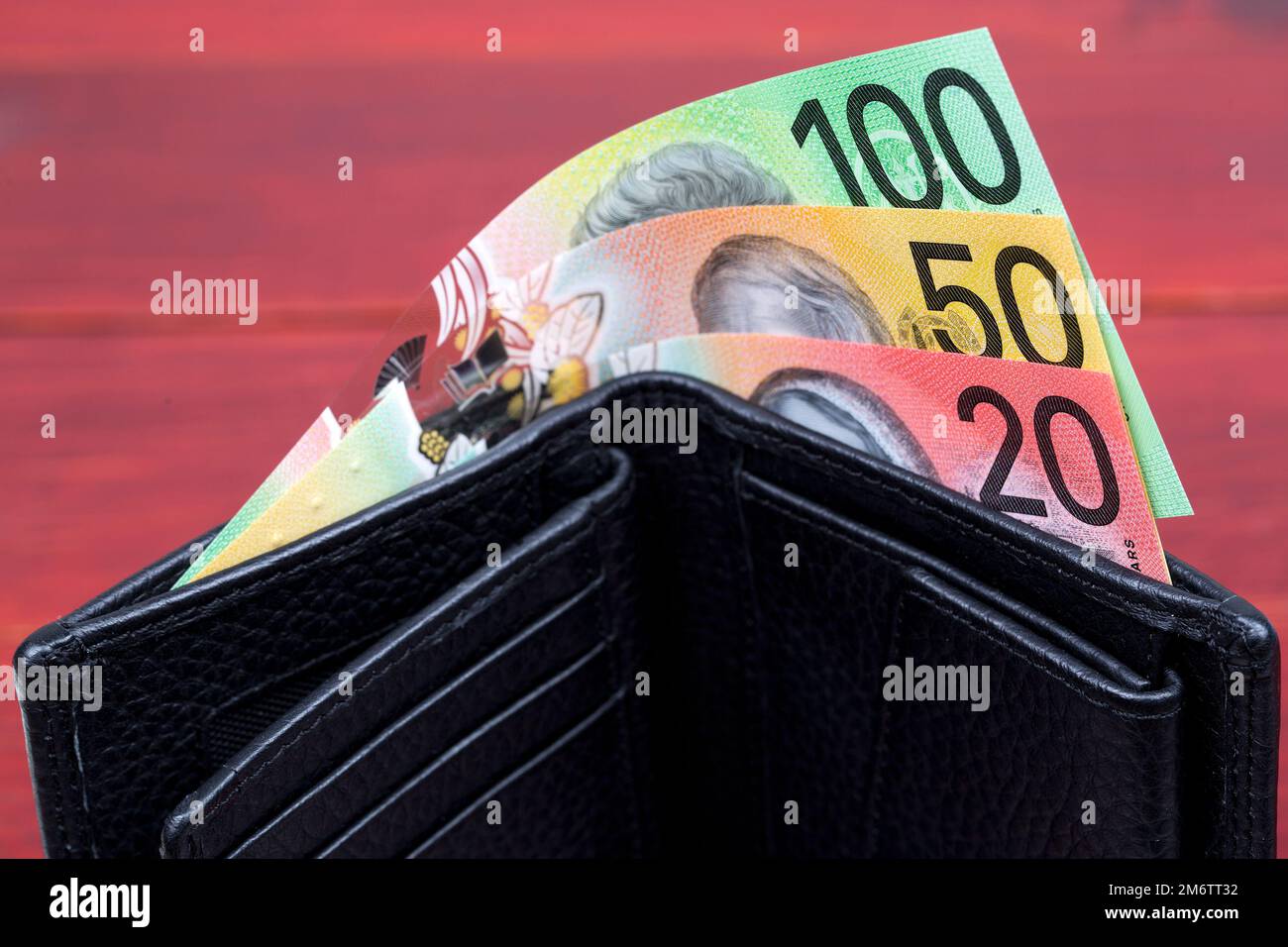 Australian money in the black wallet Stock Photo - Alamy