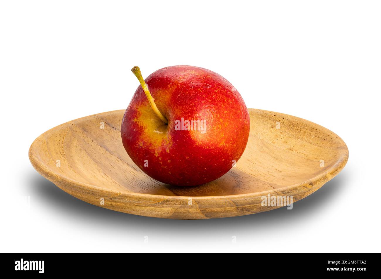 Side view of single fresh ripe crisp snack-size mini apple in wooden ...