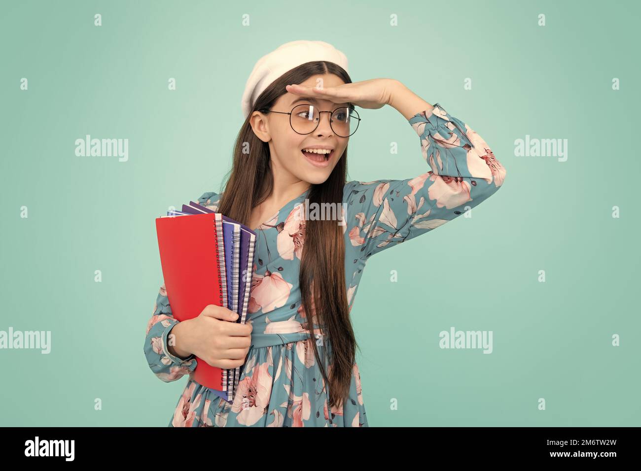 Schoolgirl with copy book posing on isolated background. Literature ...