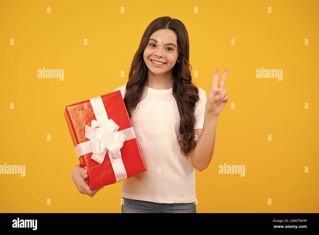 Child with gift present box on isolated background. Presents for ...