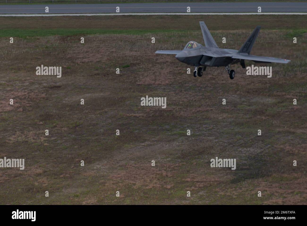 A U.S. Air Force F-22 Raptor with the 325th Fighter Wing, approaches ...
