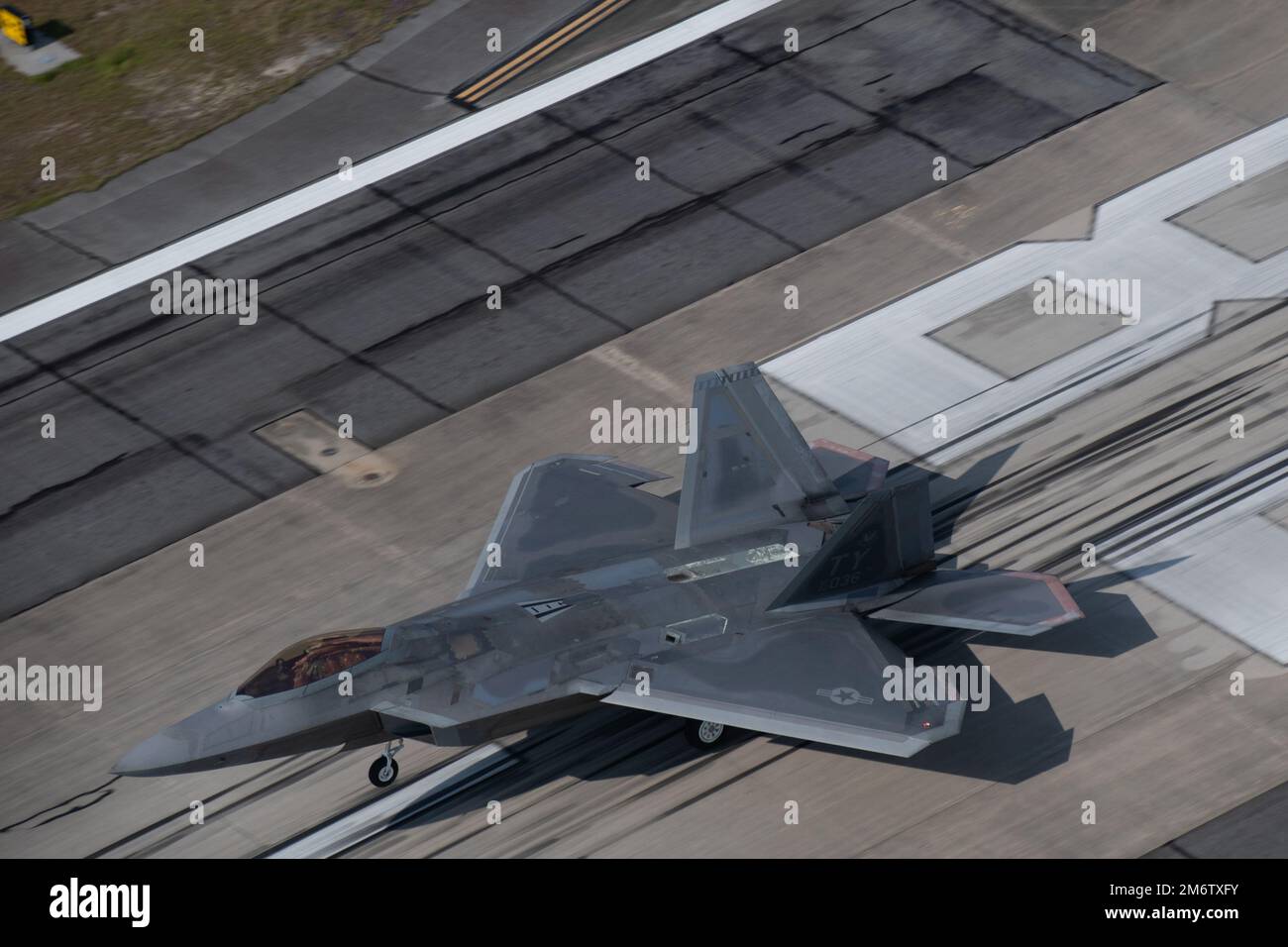 A U.S. Air Force F-22 Raptor with the 325th Fighter Wing, lands on the ...
