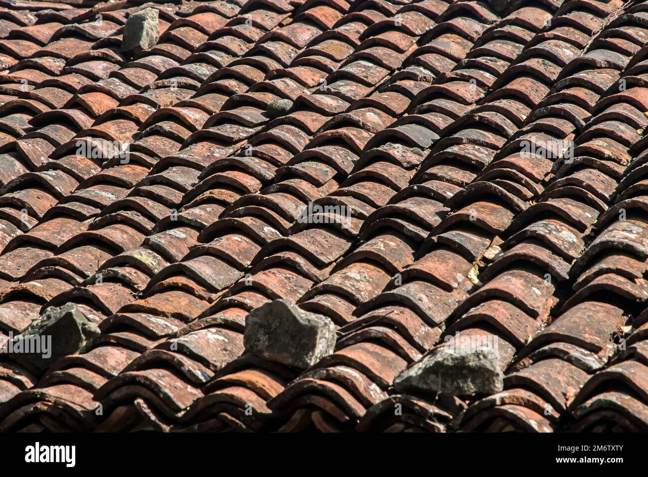 Roof of old country house from weathered aged clay tiles closeup Stock ...