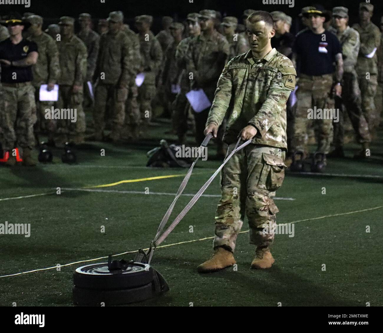 A candidate vying for their spurs, pulls a sled during the Army Combat ...