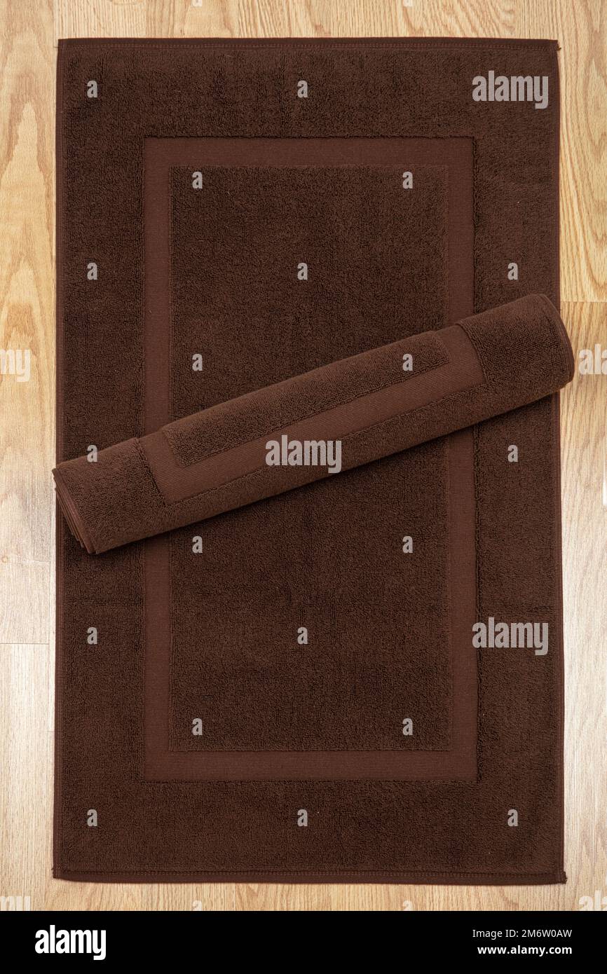 Brown bath foot towel 100% Cotton Terry Towels Isolated with White ...