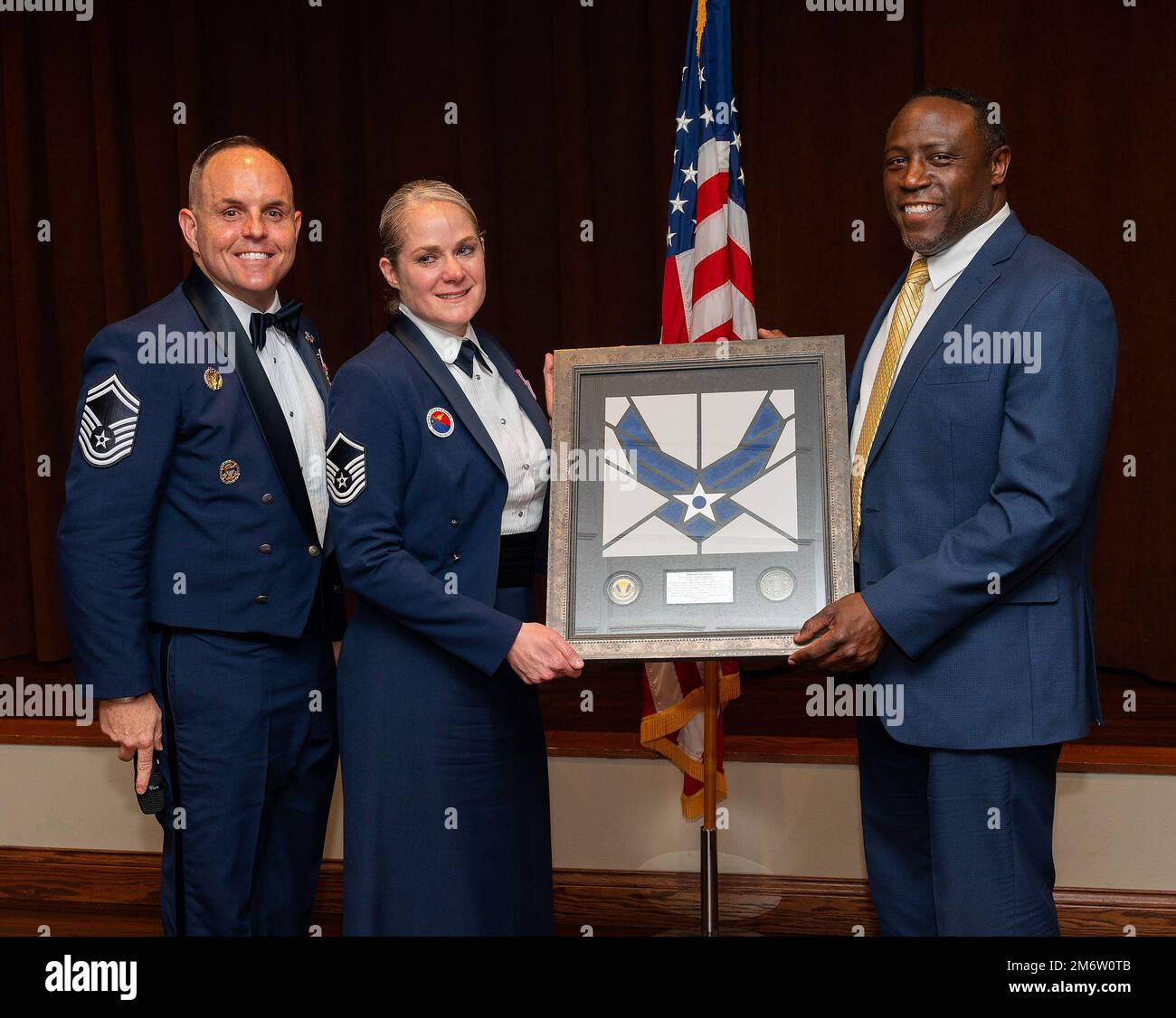 Audric Bills, 88th Force Support Squadron director, presents Master Sgt ...