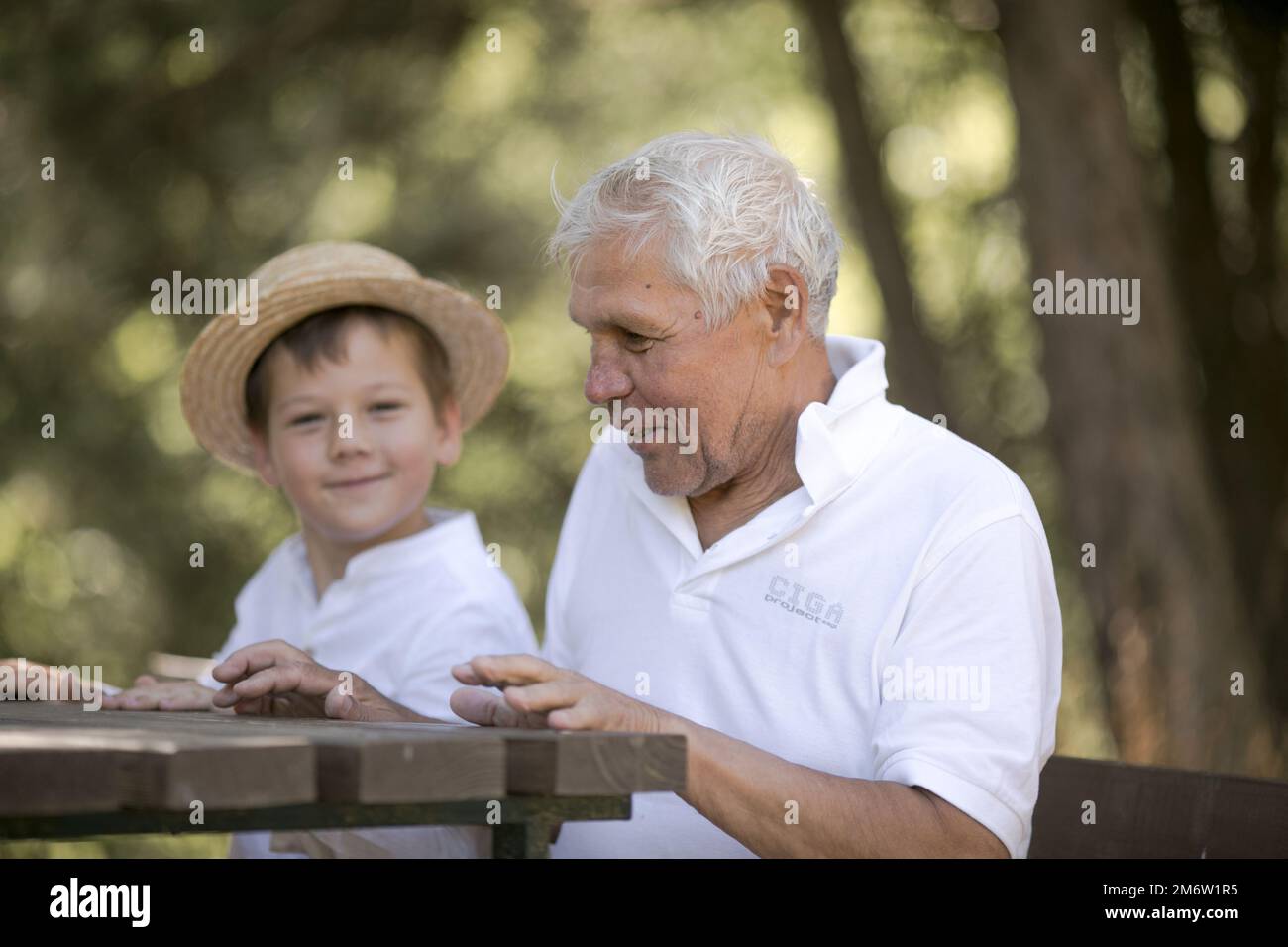 Happy senior man Grandfather with cute little boy grandson playing in ...