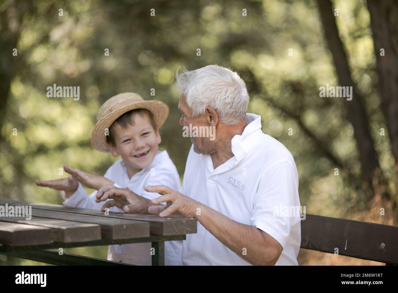 Happy senior man Grandfather with cute little boy grandson playing in ...