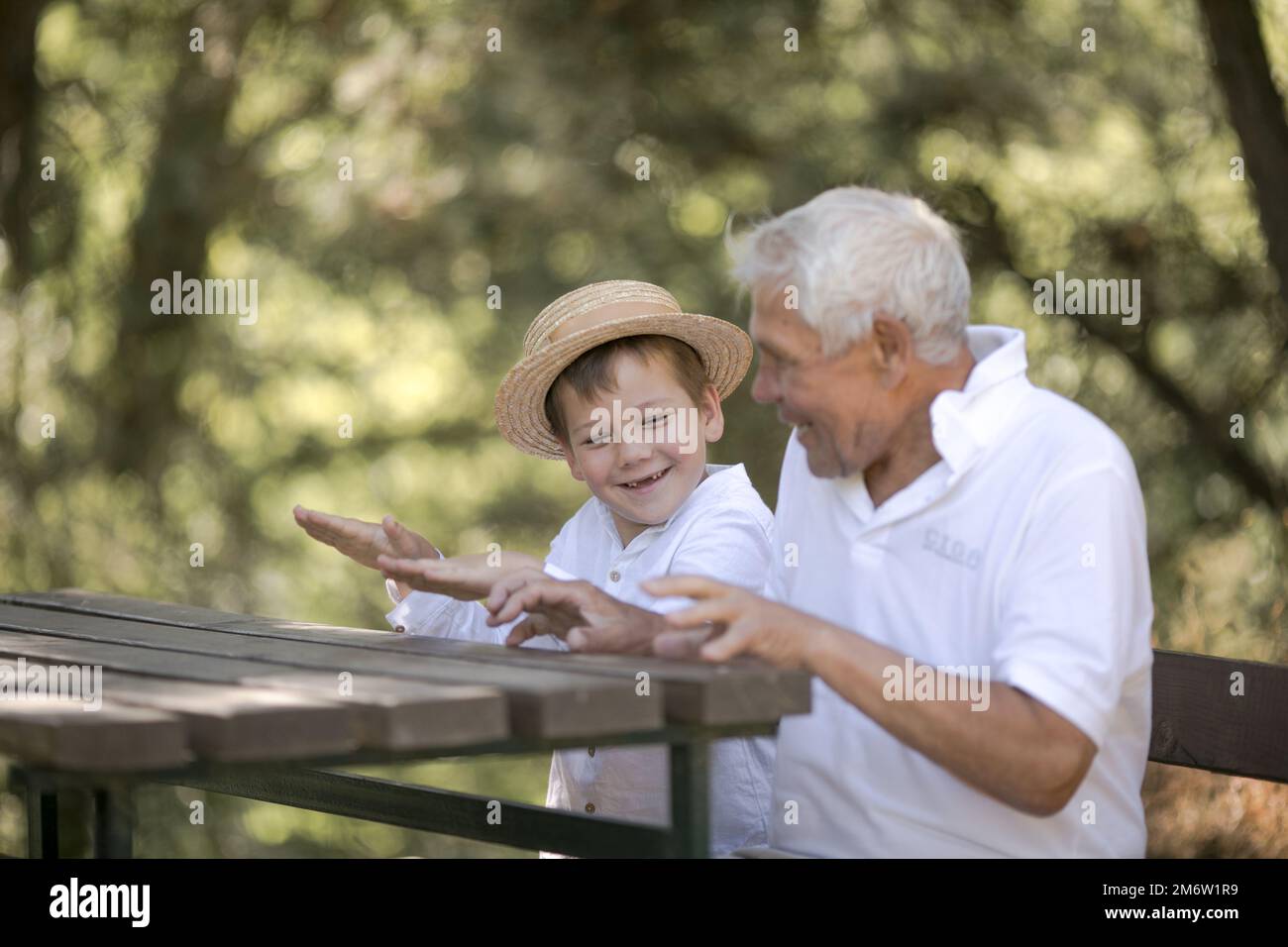 Happy senior man Grandfather with cute little boy grandson playing in ...