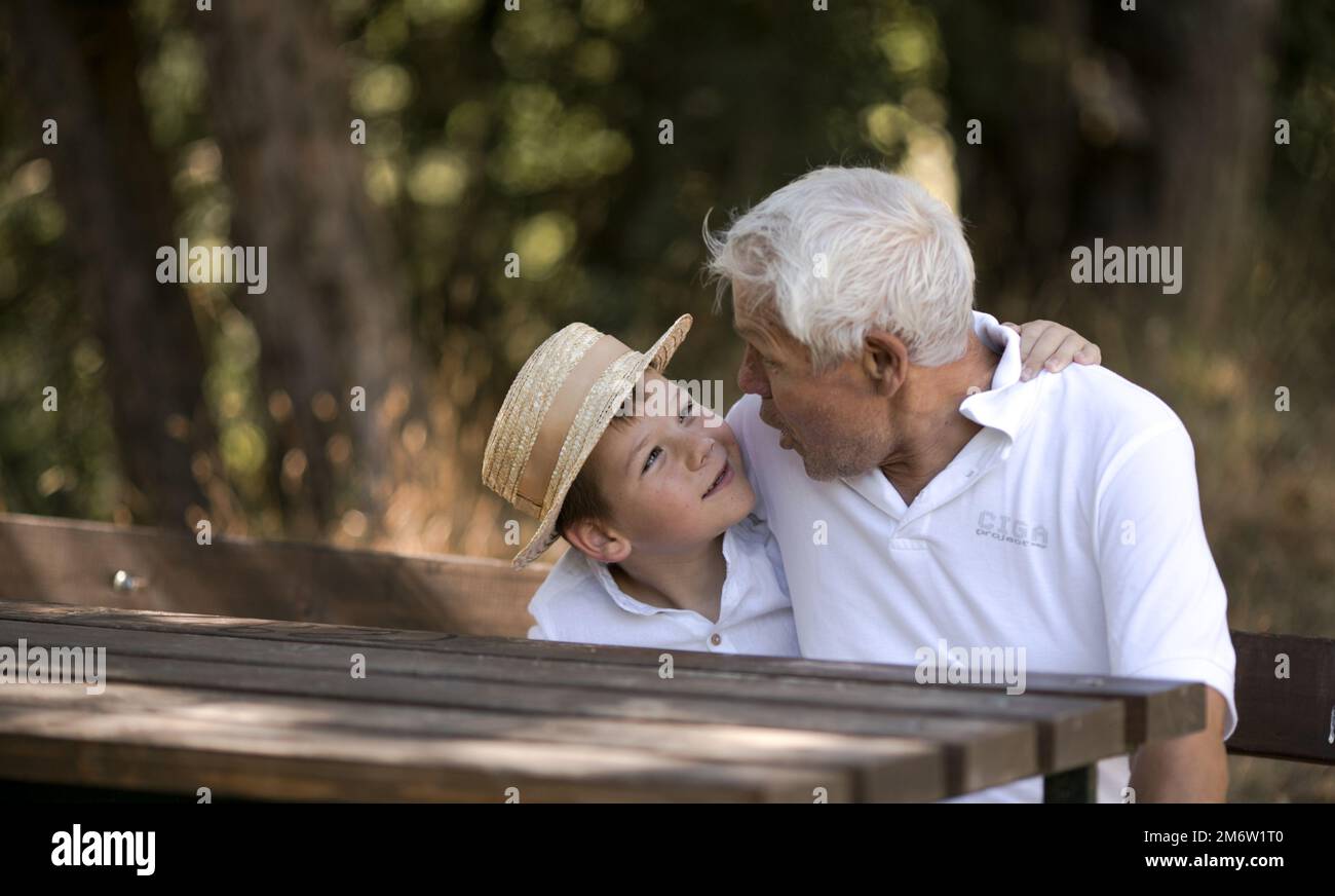 Happy senior man Grandfather with cute little boy grandson playing in ...