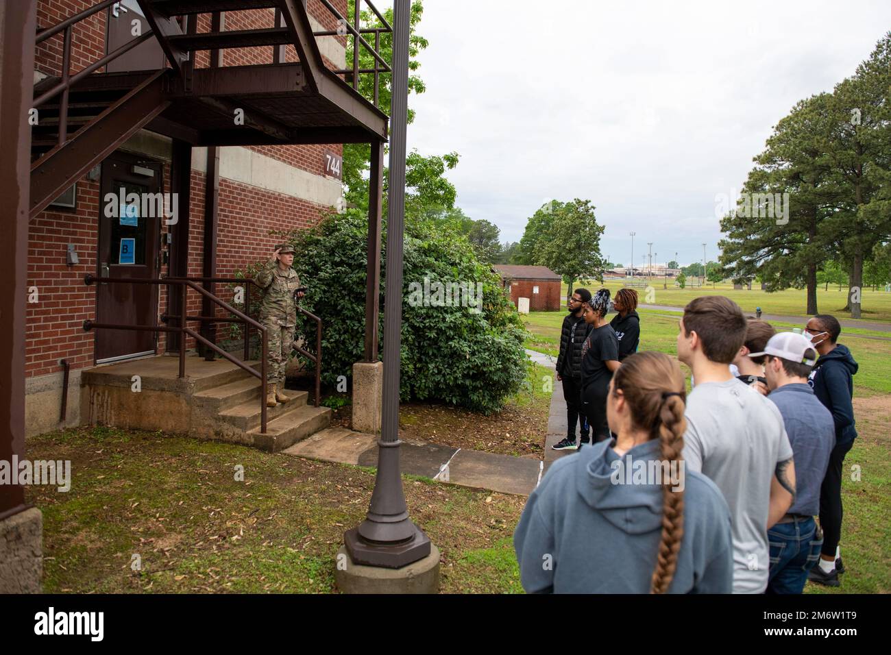 Prospective recruits are briefed before entering a dorm facility at ...