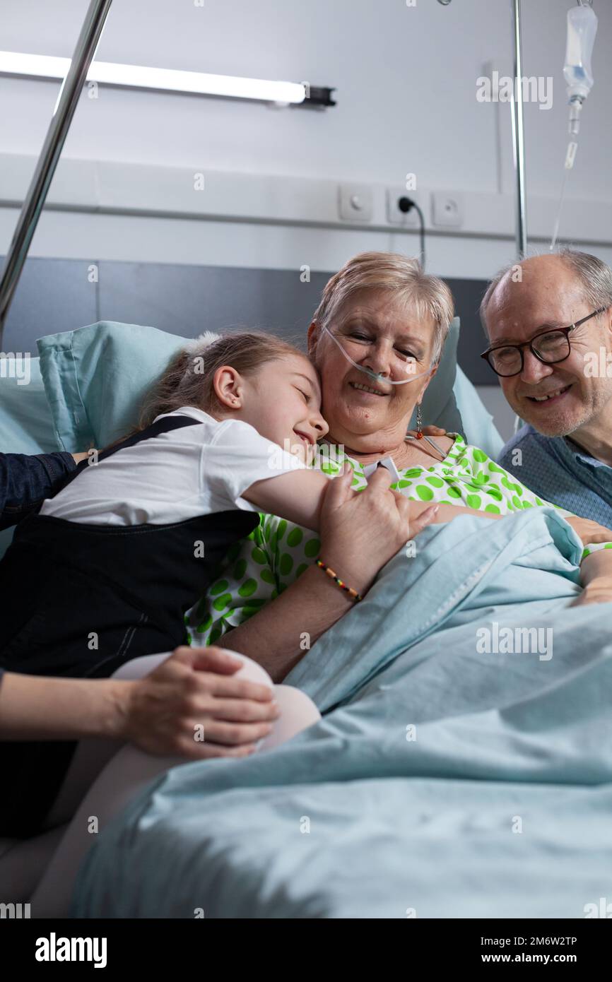 Woman under medical supervision in geriatric patients clinic cuddling ...