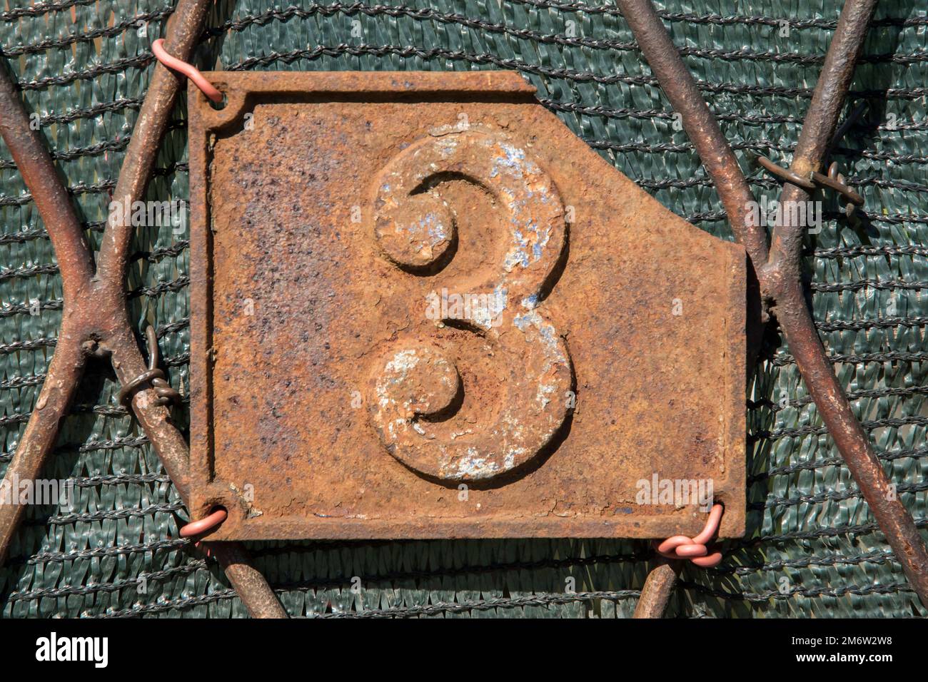 Old retro weathered cast iron plate with number 3 closeup Stock Photo ...