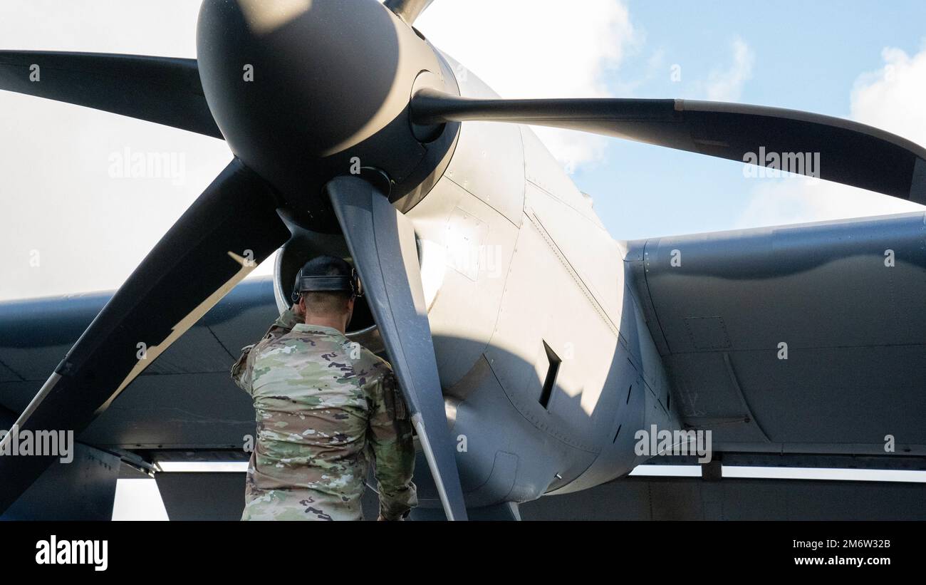 A maintainer with the 353d Special Operations Wing conducts post-flight ...
