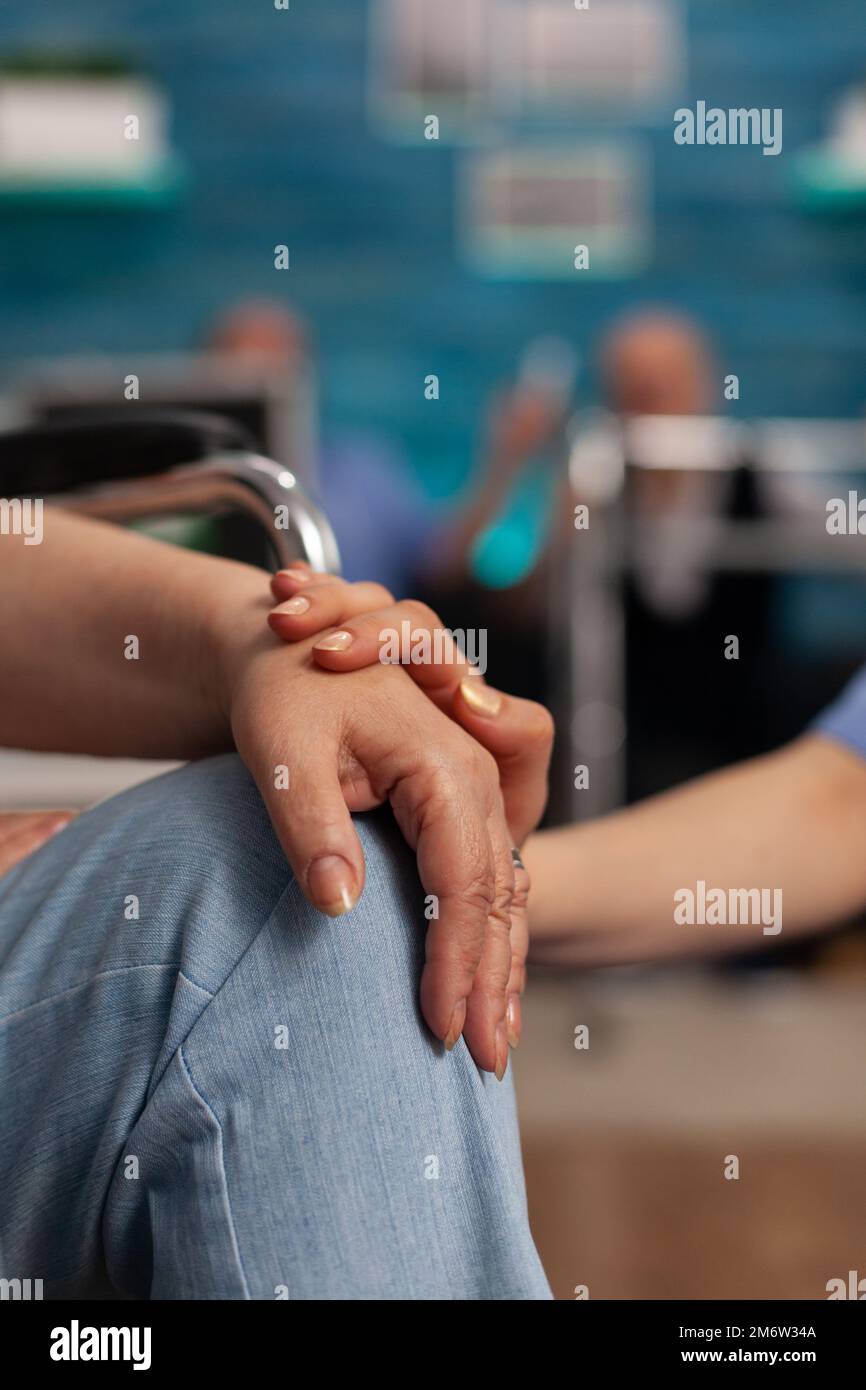 Female senior resident in wheelchair receiving specialized care from a ...