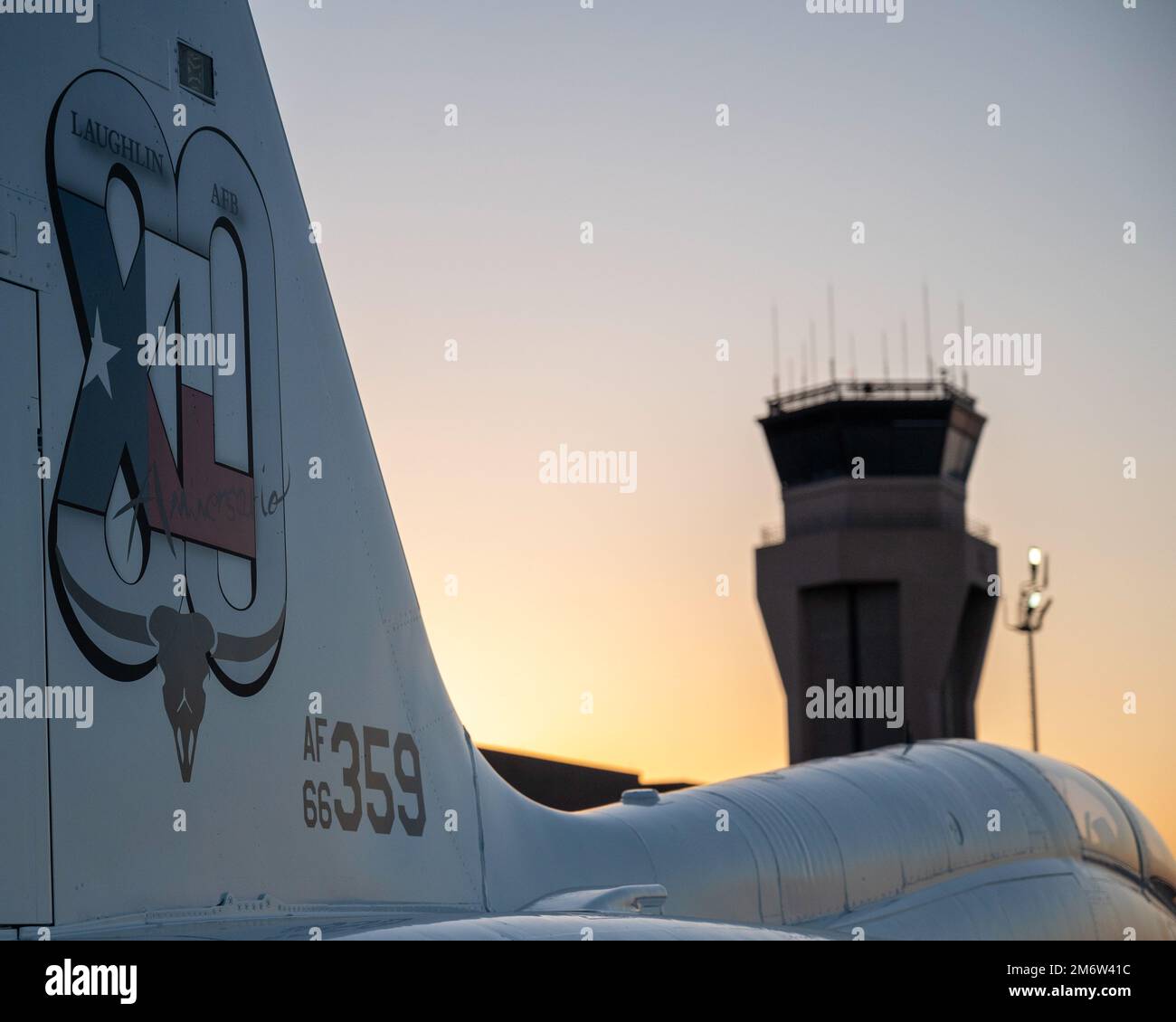 A T-38 Talon sits on the flightline in the dusk while Laughlin's Air ...