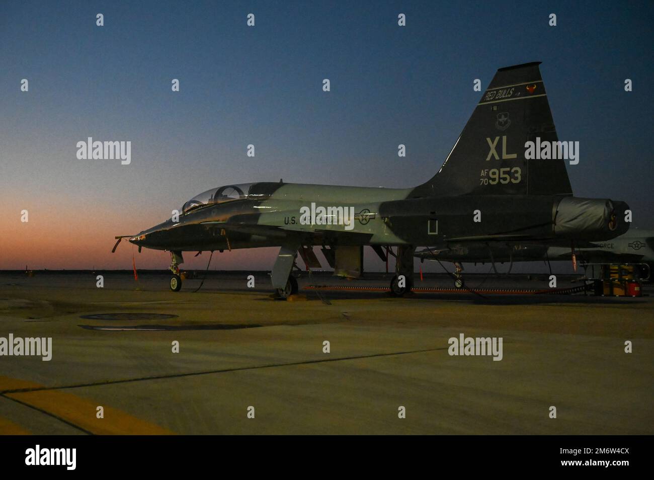 A T-38 Talon is parked on the flightline during a sunset at Laughlin ...