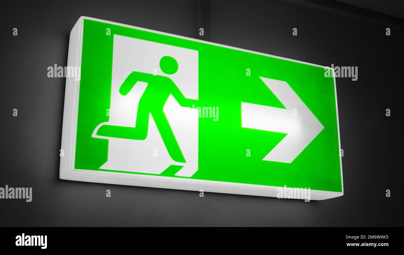 Green exit sign light Stock Photo - Alamy