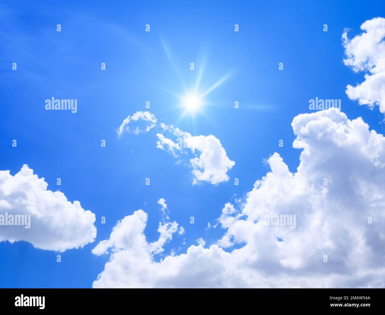 Sunny blue sky with bright clouds background Stock Photo - Alamy