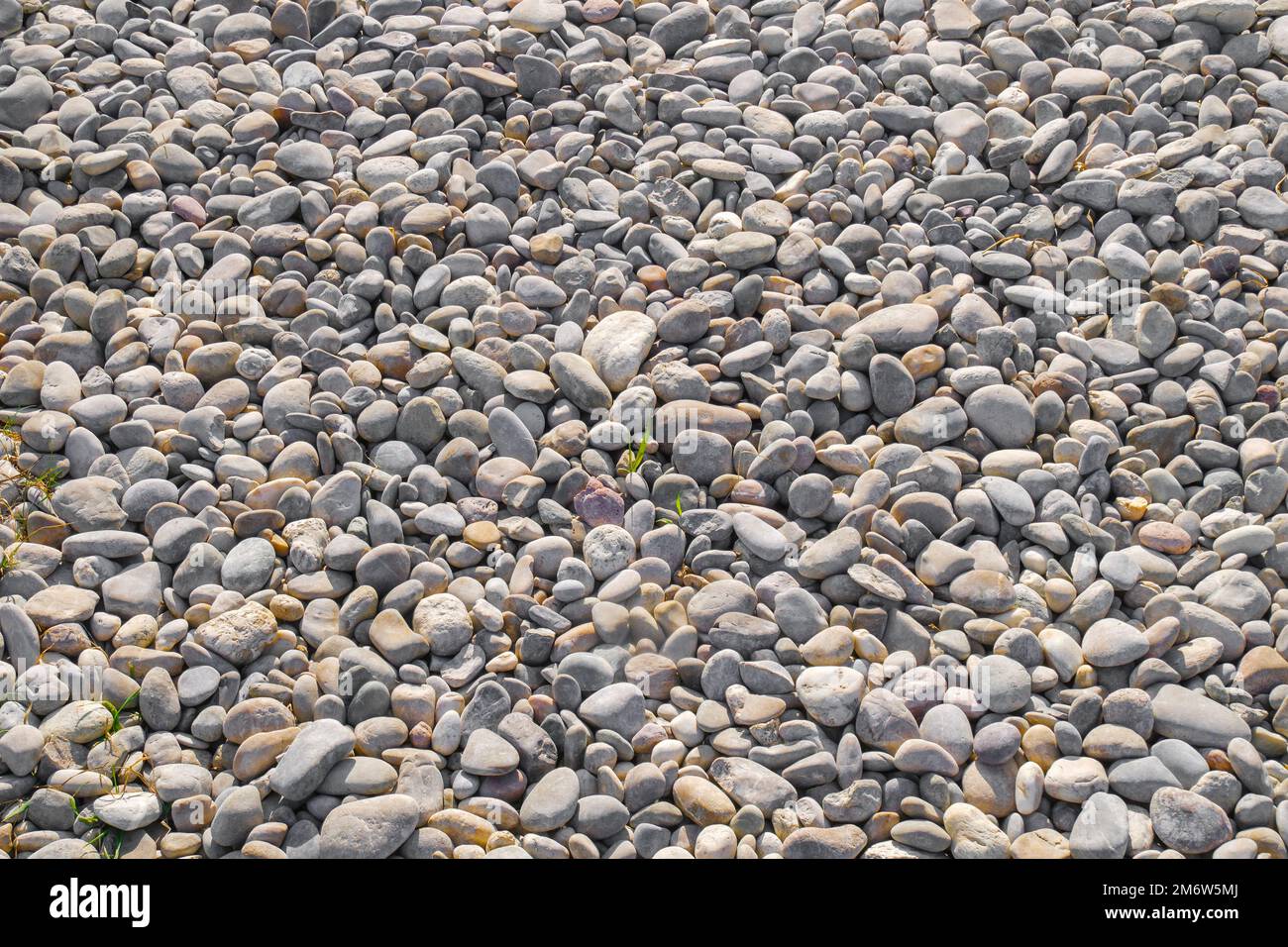 Bright pebbles background Stock Photo - Alamy