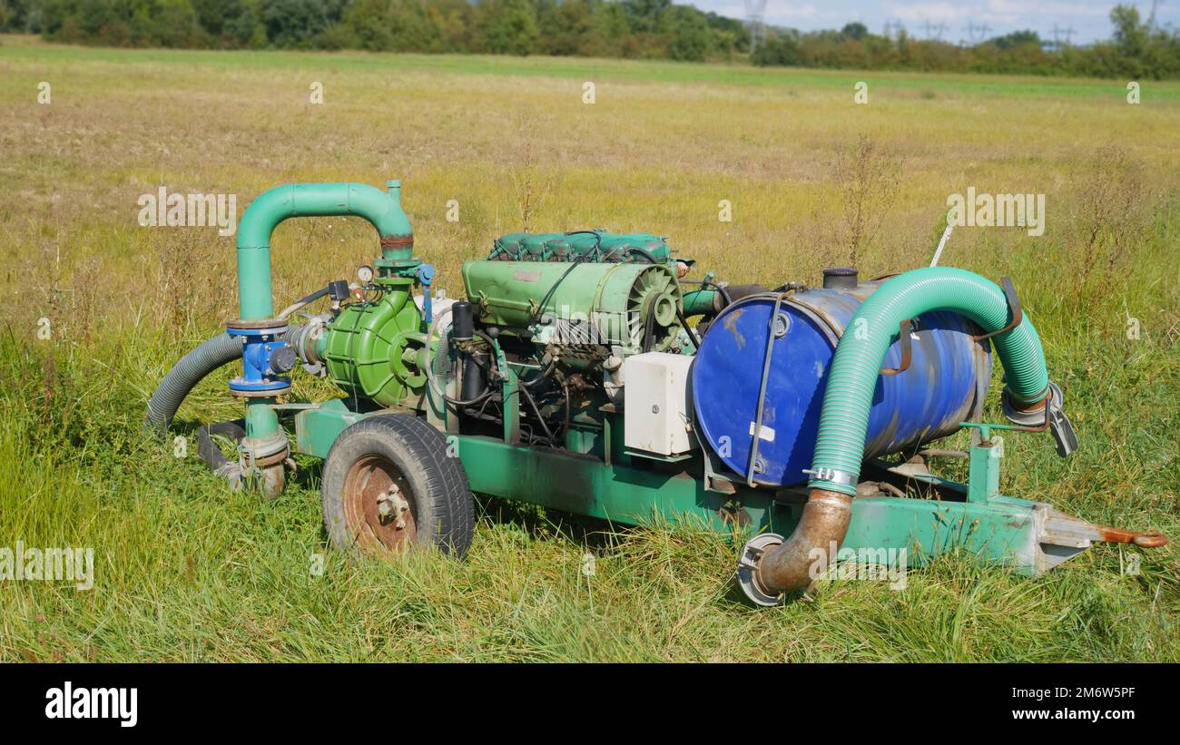 Old water pump in the field Stock Photo - Alamy